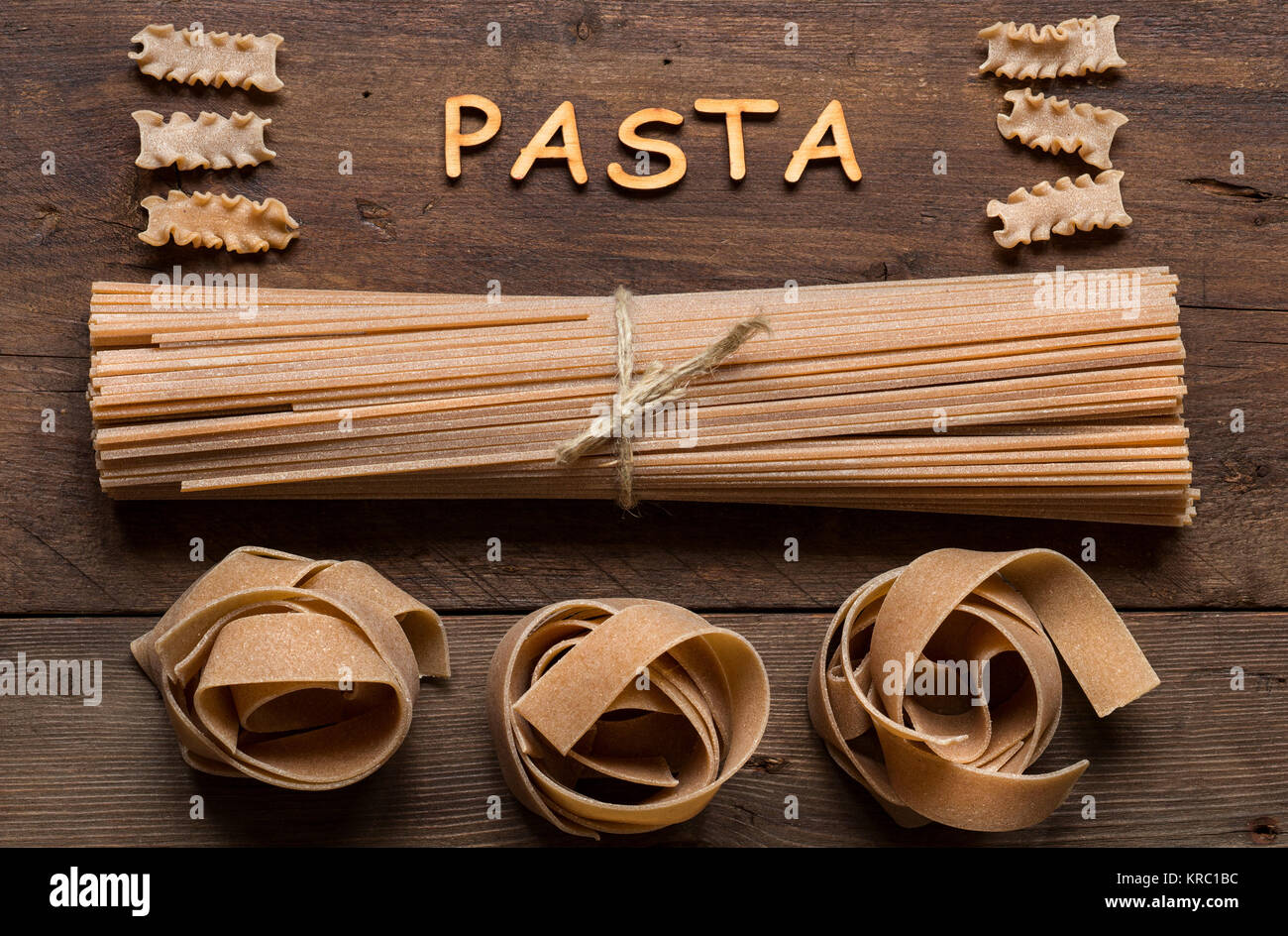 Whole wheat italian pasta and word Pasta Stock Photo - Alamy