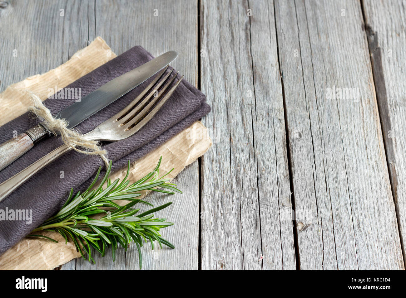 Vintage Table setting with rosemary decor Stock Photo - Alamy