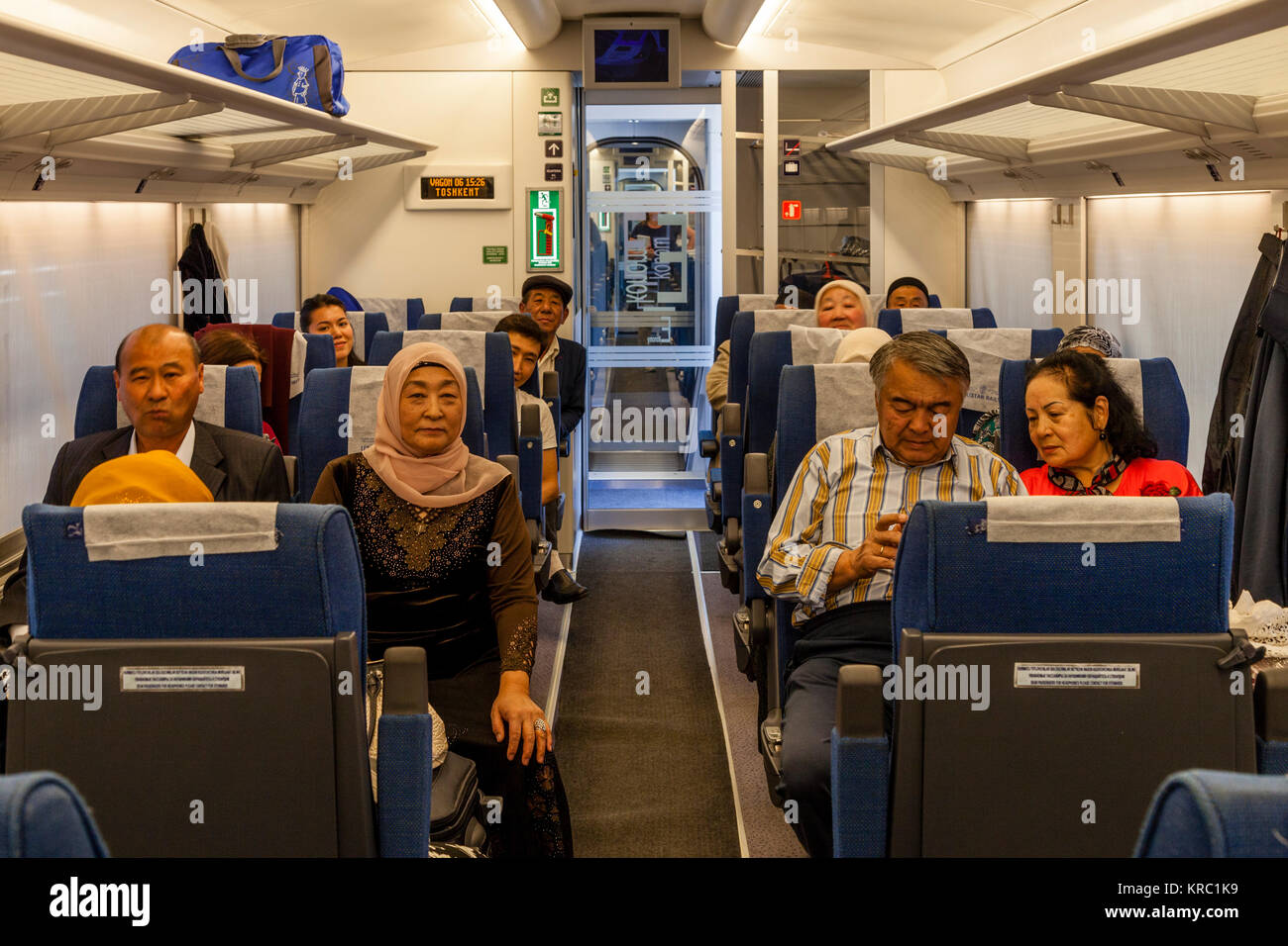 Uzbek Passengers Sitting On The Afrosiyob High Speed Train, The Railway ...