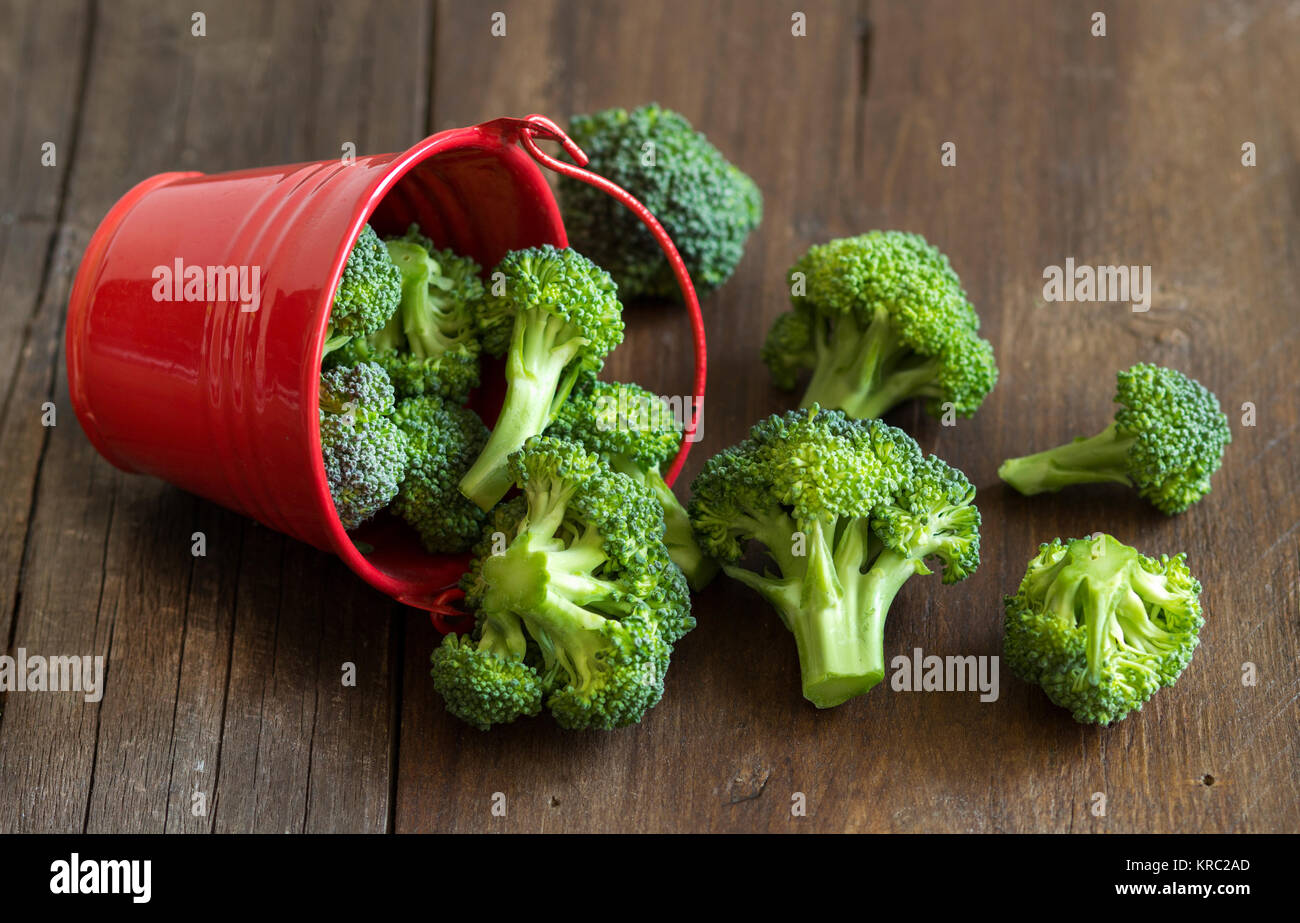Green broccoli in red bucket Stock Photo - Alamy