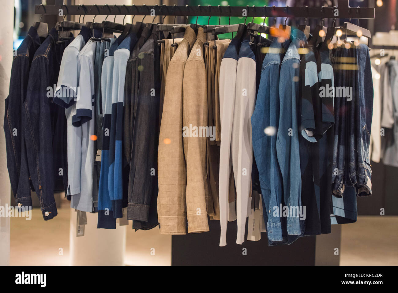 Woman clothing on racks in a store in Paris Stock Photo - Alamy