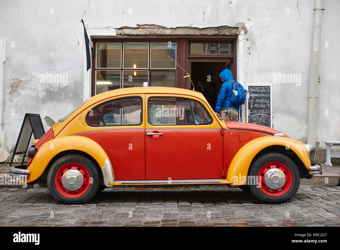 Retro classic car and grunge coffee shop facade. Travel backpacker ...