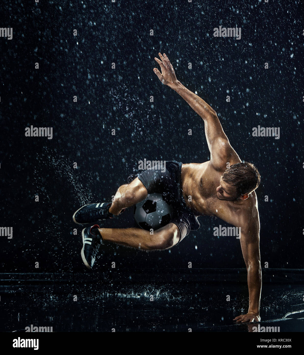 Water drops around football player under water Stock Photo - Alamy