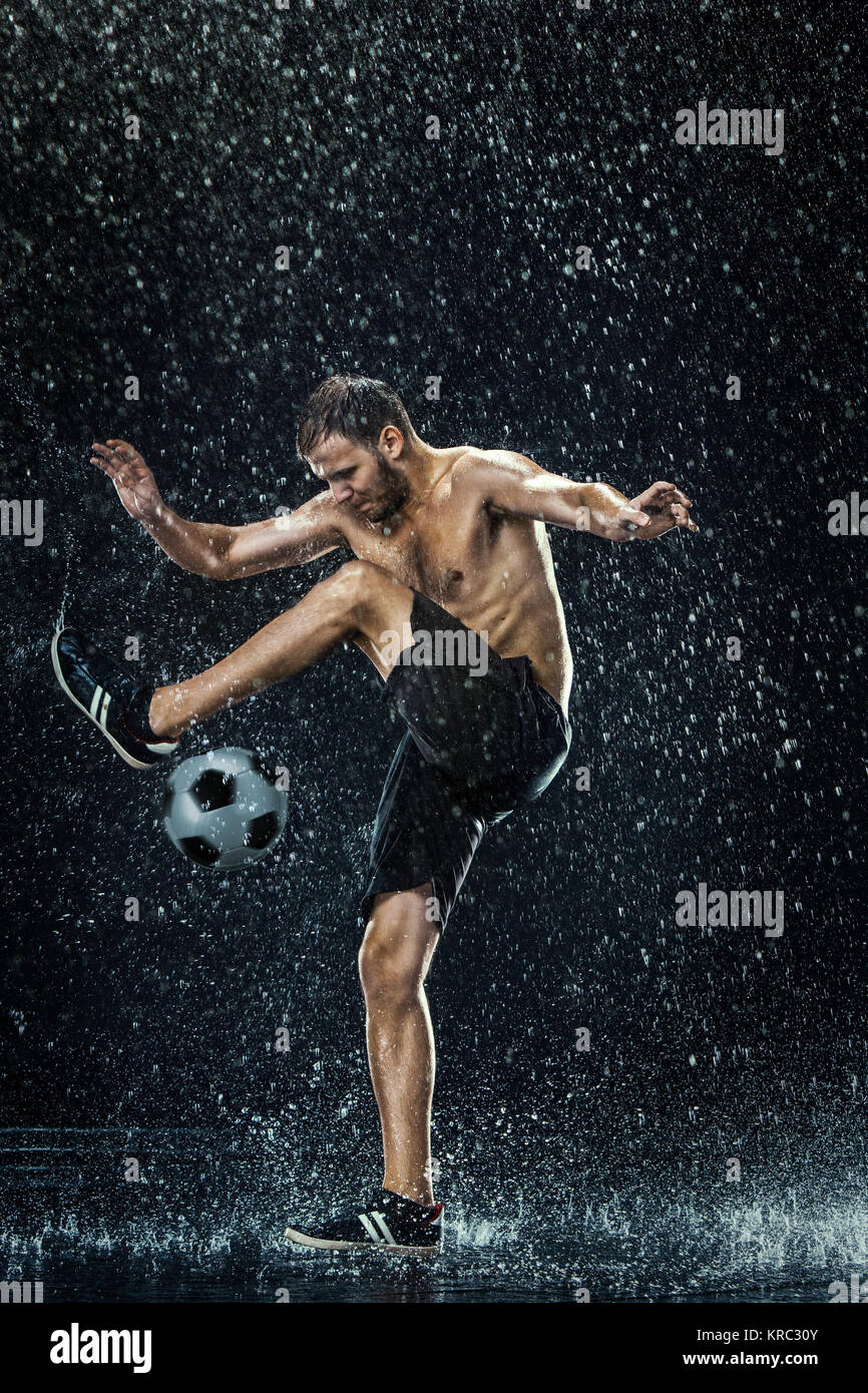 Water drops around football player under water Stock Photo - Alamy