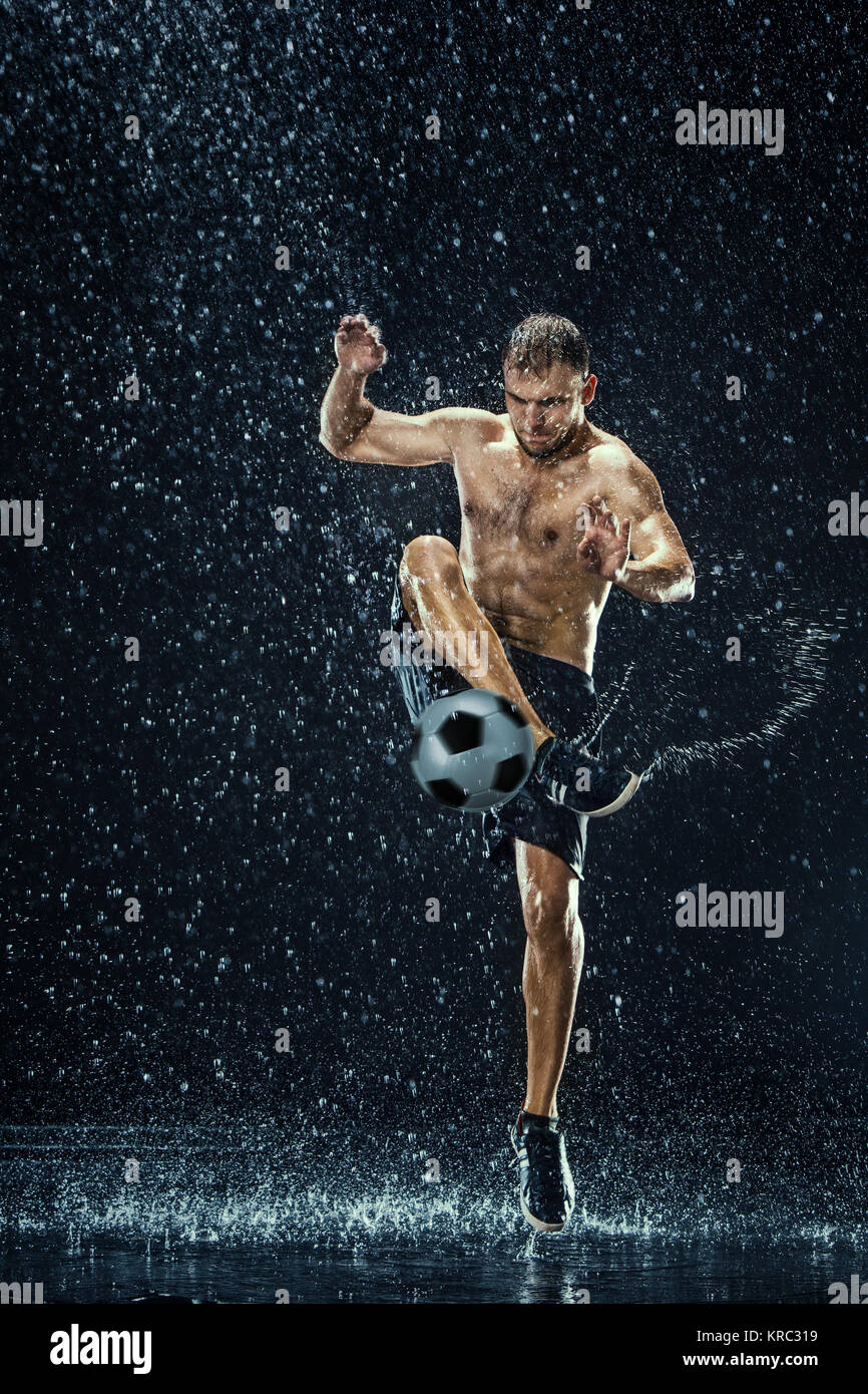 Water drops around football player under water Stock Photo - Alamy