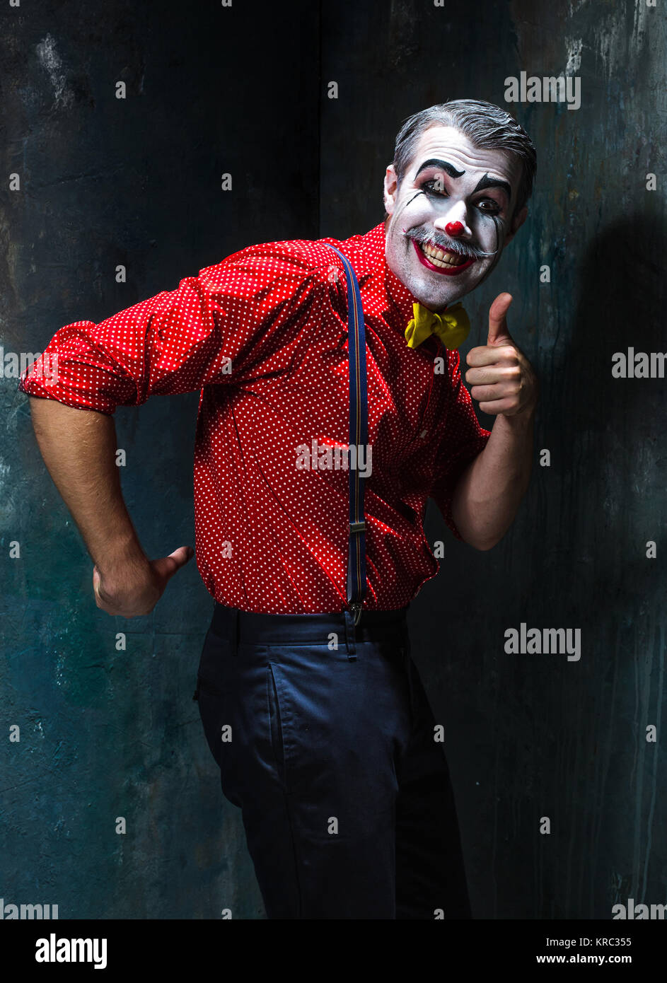 Terrible clown and Halloween theme: Crazy red clown in a shirt with ...