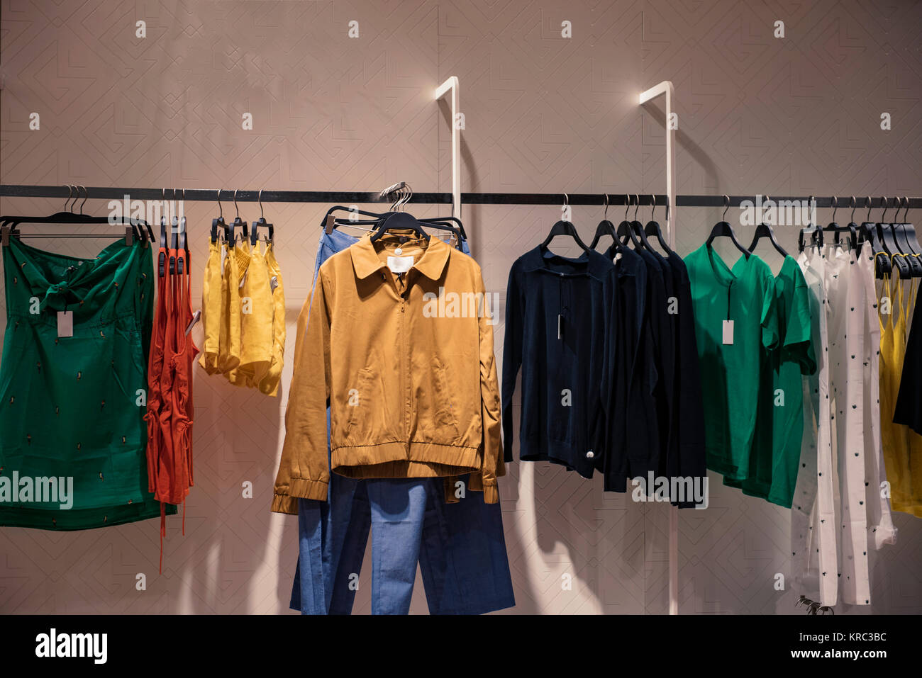Women clothes in front with store background in Paris Stock Photo - Alamy