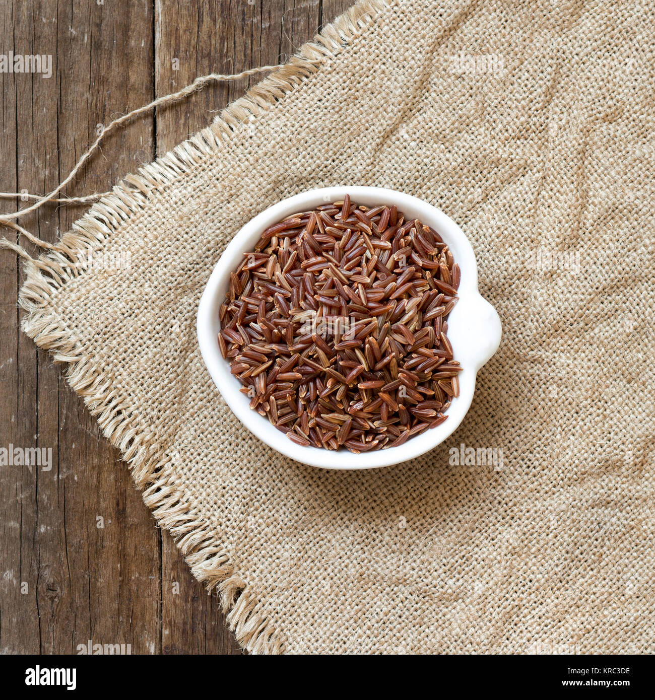 Raw red rice in a bowl Stock Photo - Alamy