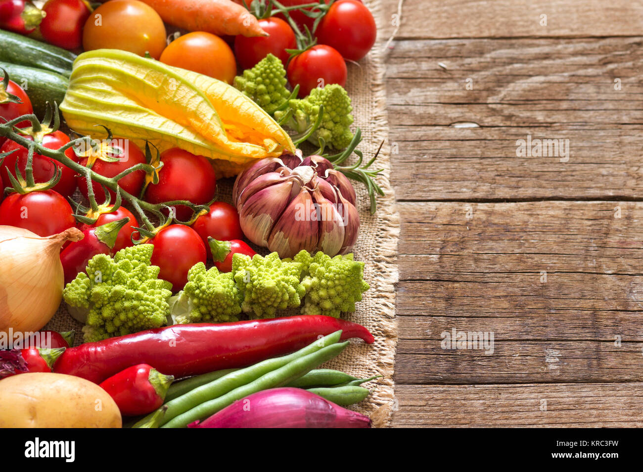 Vegetables on a wooden table Stock Photo - Alamy
