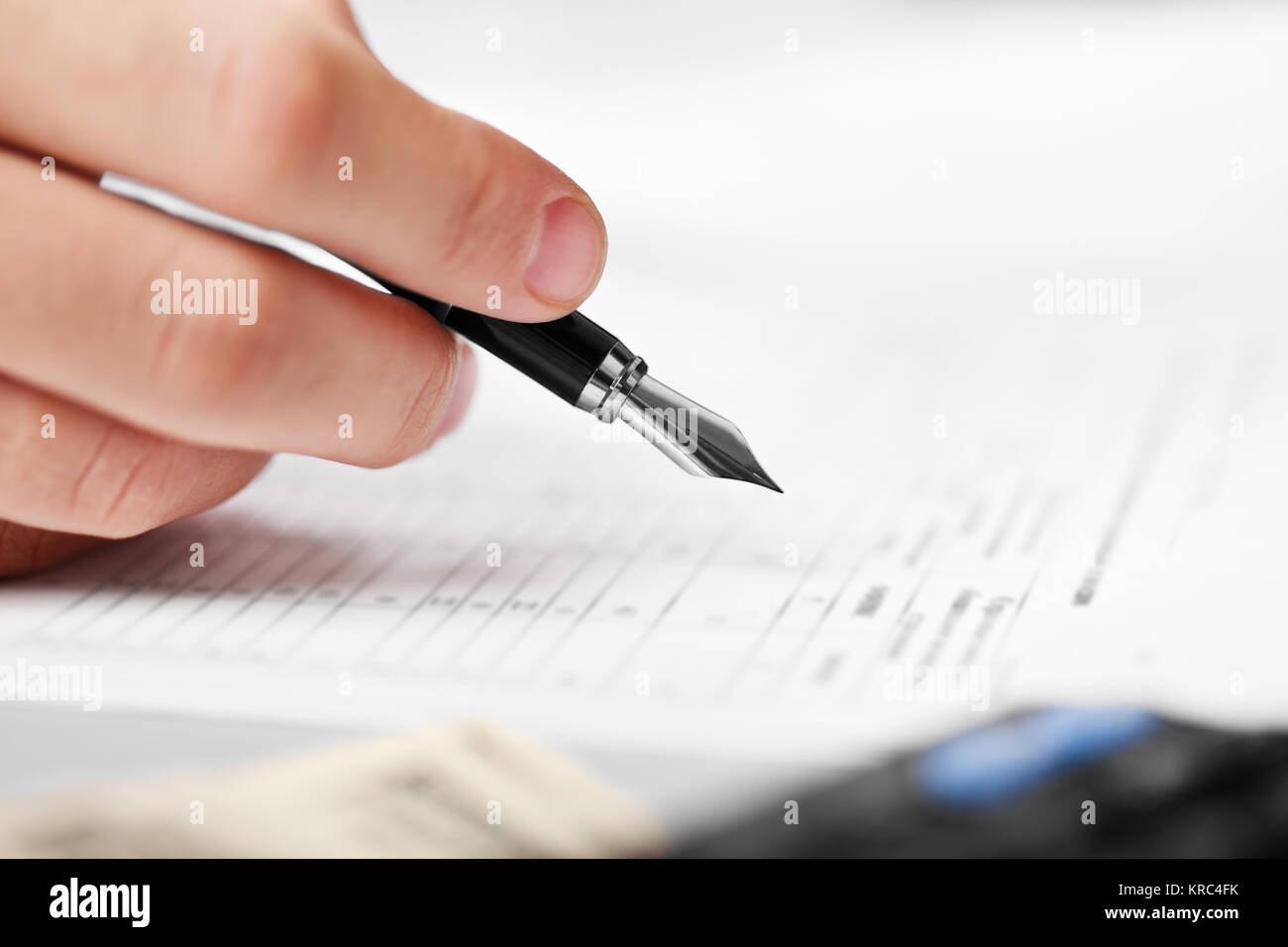 Working business man hand pen writing paper document at office ...
