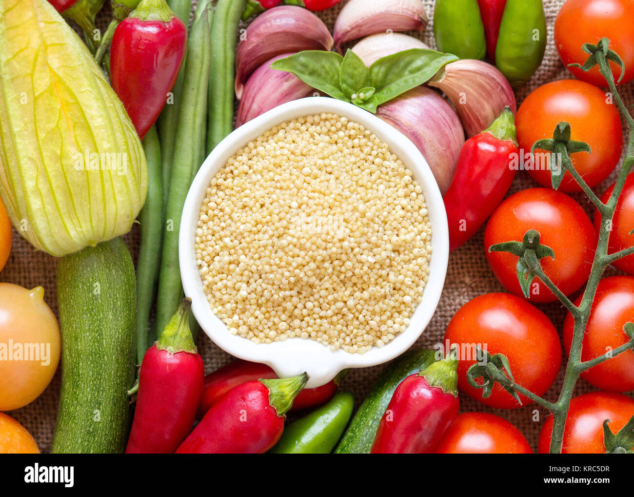 Raw Organic millet and vegetables Stock Photo - Alamy