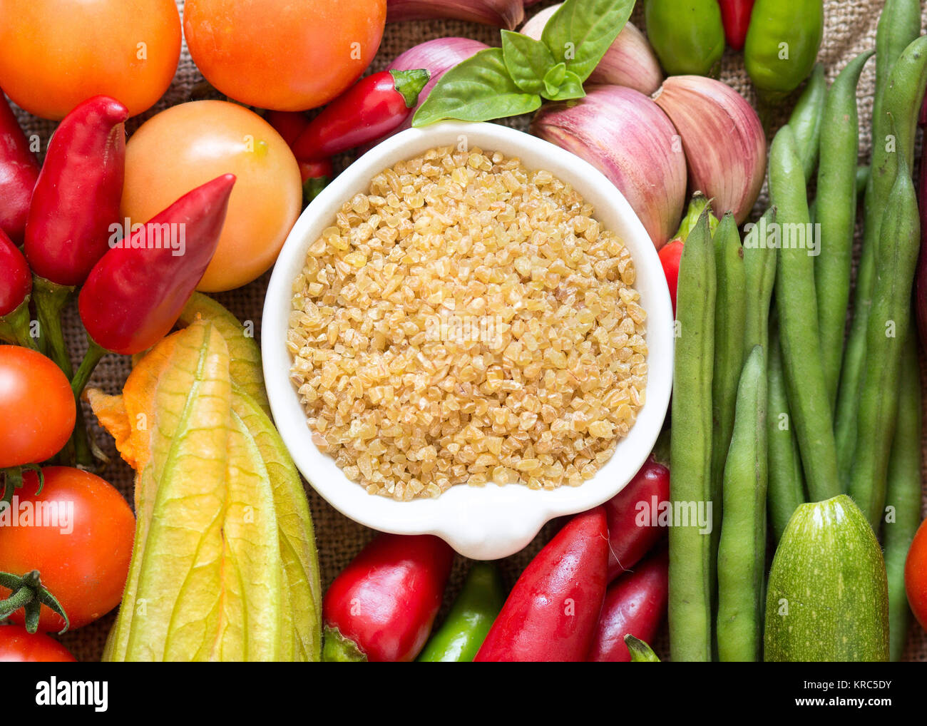 Raw Organic bulgur and vegetables Stock Photo - Alamy
