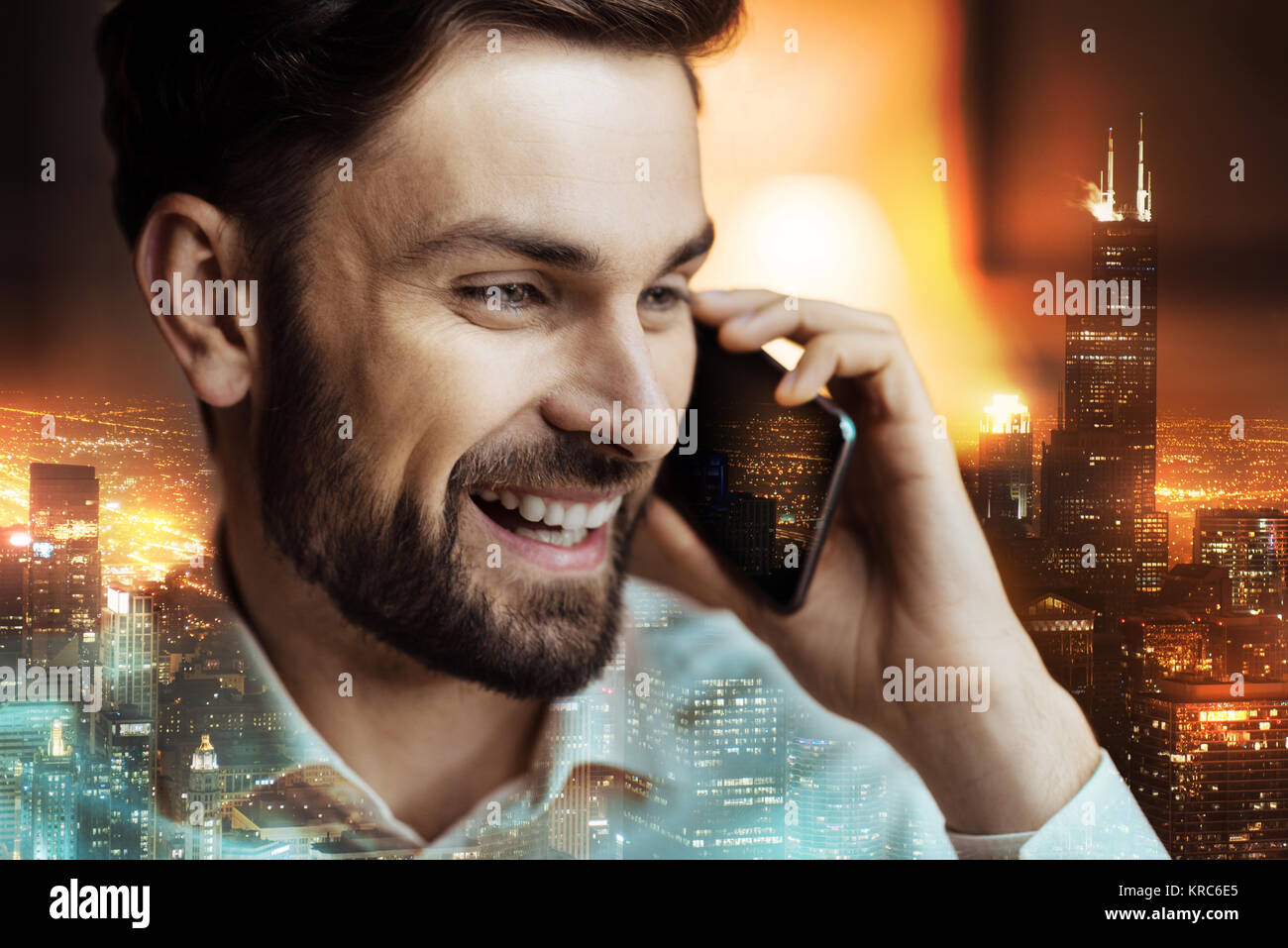 Close up of a happy man talking on the phone Stock Photo - Alamy