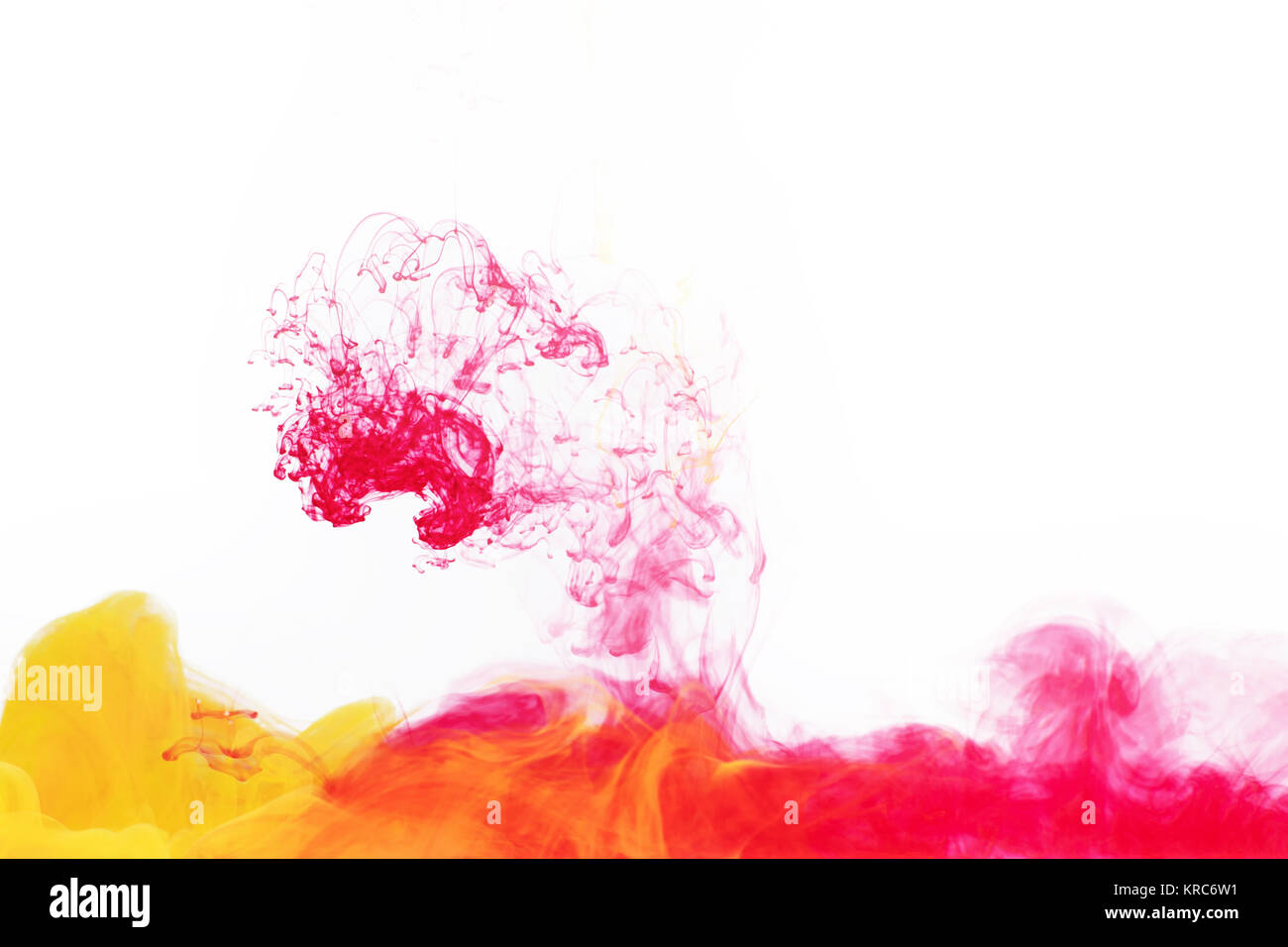 Colorful acrylic ink in water over white background. Abstract ...