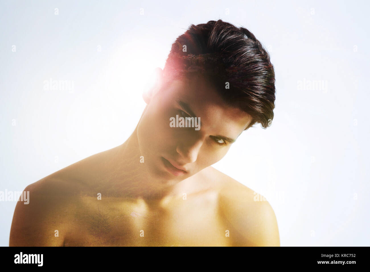 Handsome young man looking at you Stock Photo - Alamy