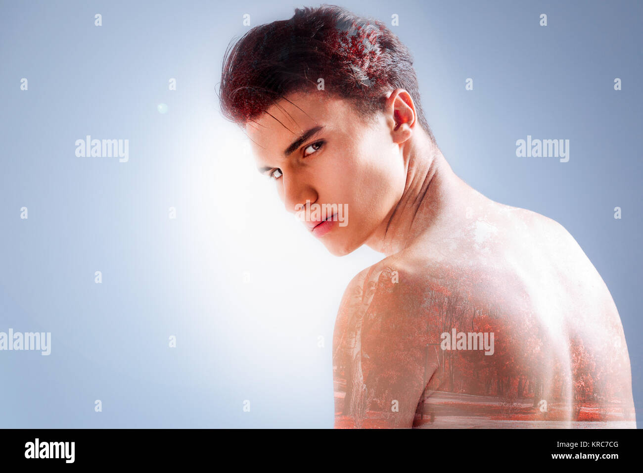 Pleasant good looking man turning to you Stock Photo - Alamy