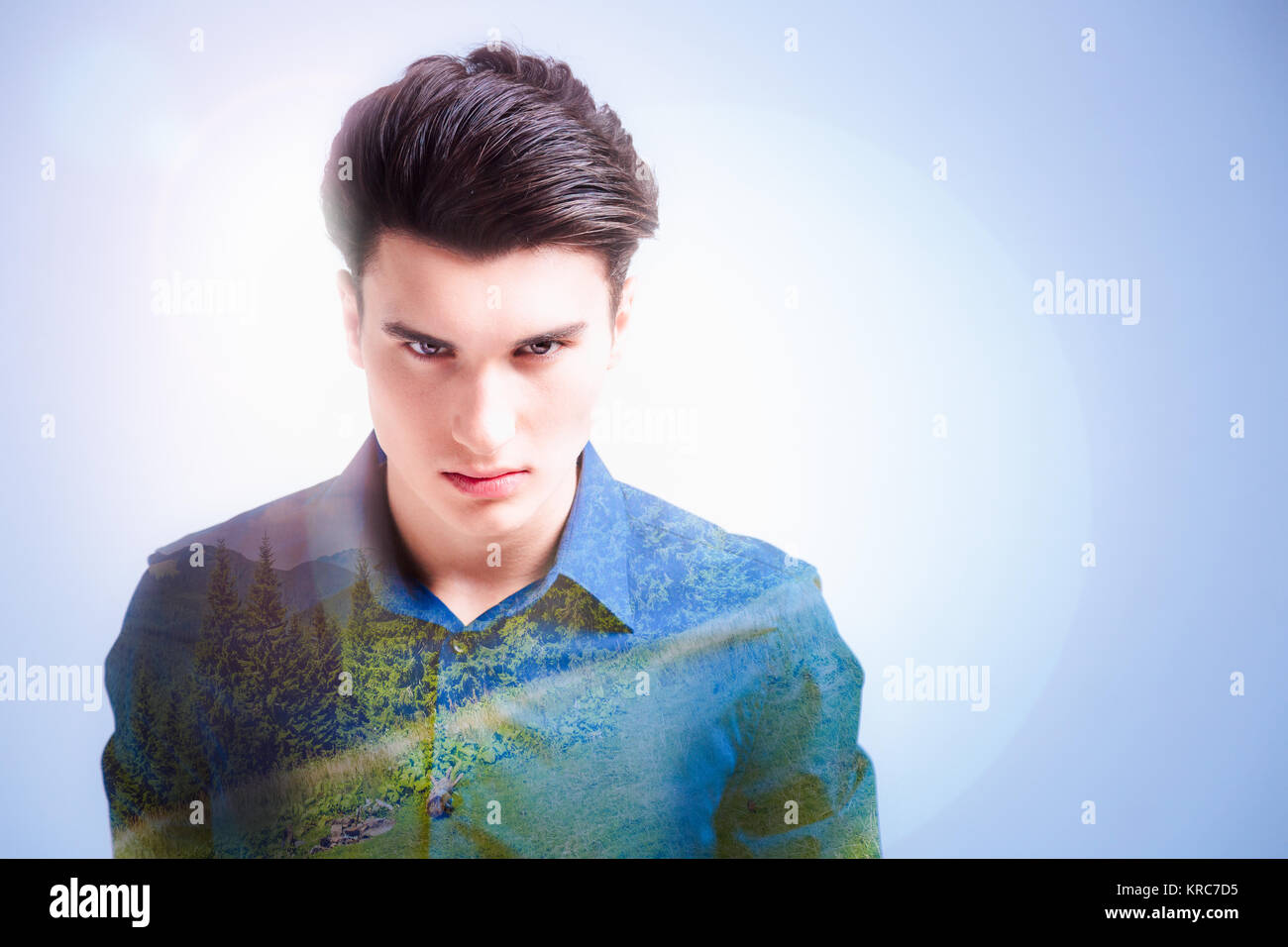 Serious creative man imagining nature landscape Stock Photo - Alamy