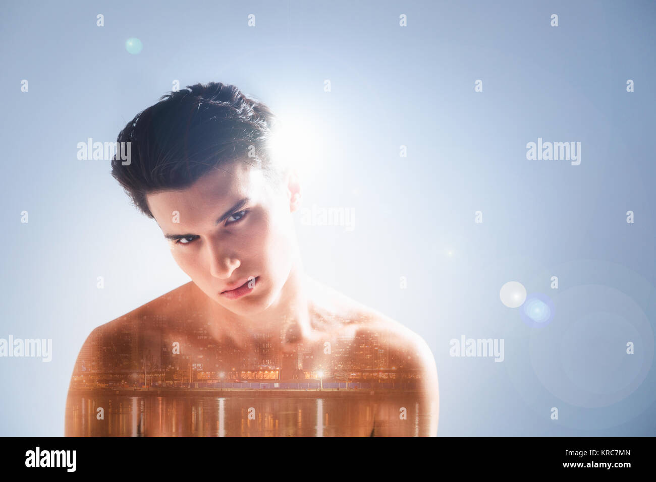 Pleasant creative man thinking about night city lights Stock Photo - Alamy