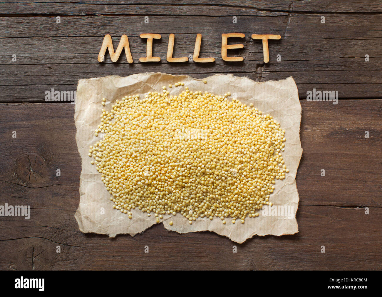 Raw millet with a word Millet Stock Photo - Alamy