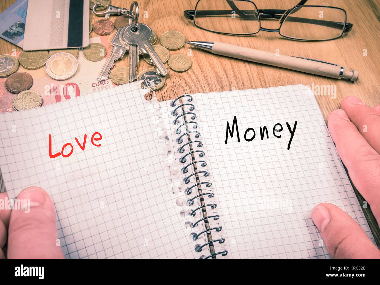 Choosing money over love concept Stock Photo - Alamy