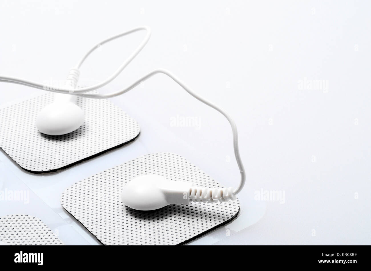Close up of white electrodes and electrical stimulation device Stock ...