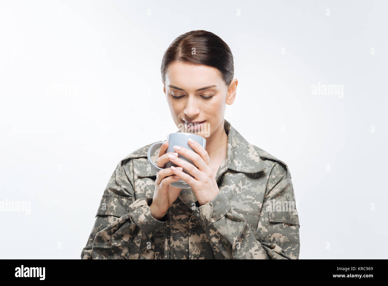 Calm female soldier enjoying coffee Stock Photo - Alamy