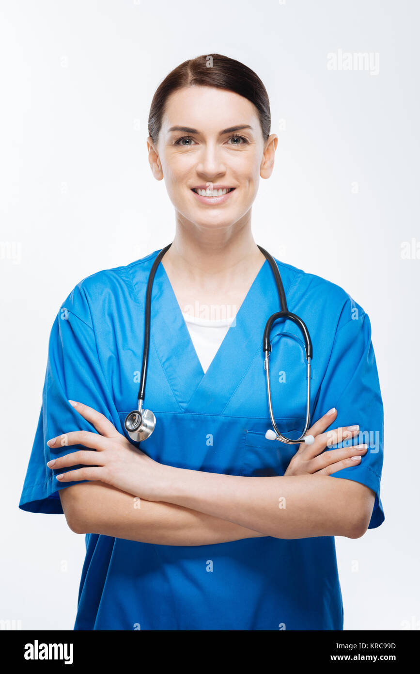 Pleasant female doctor treating people Stock Photo - Alamy