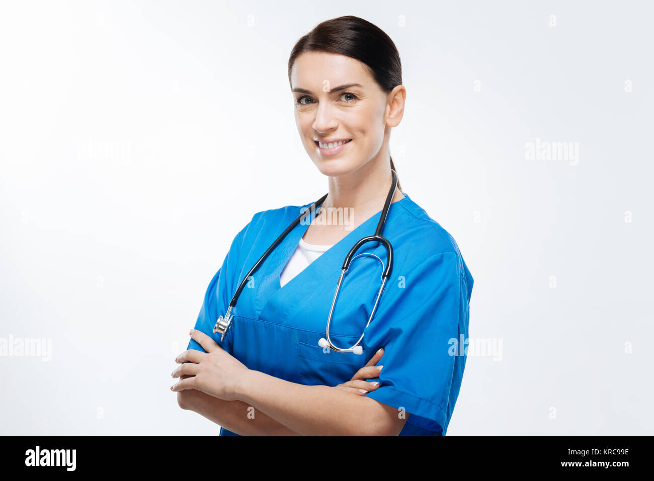 Joyful female doctor treating person Stock Photo - Alamy
