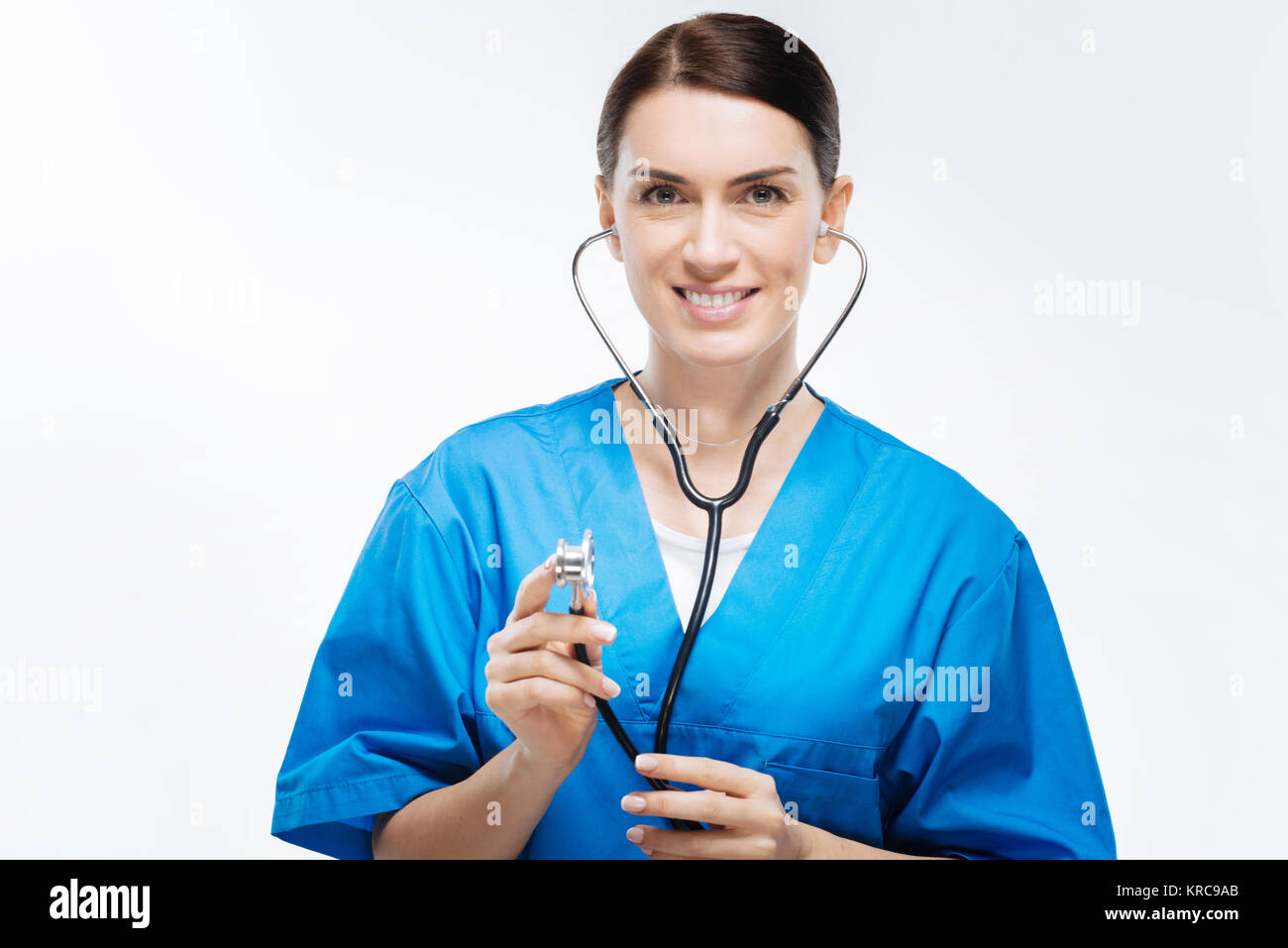Professional female doctor using stethoscope Stock Photo - Alamy