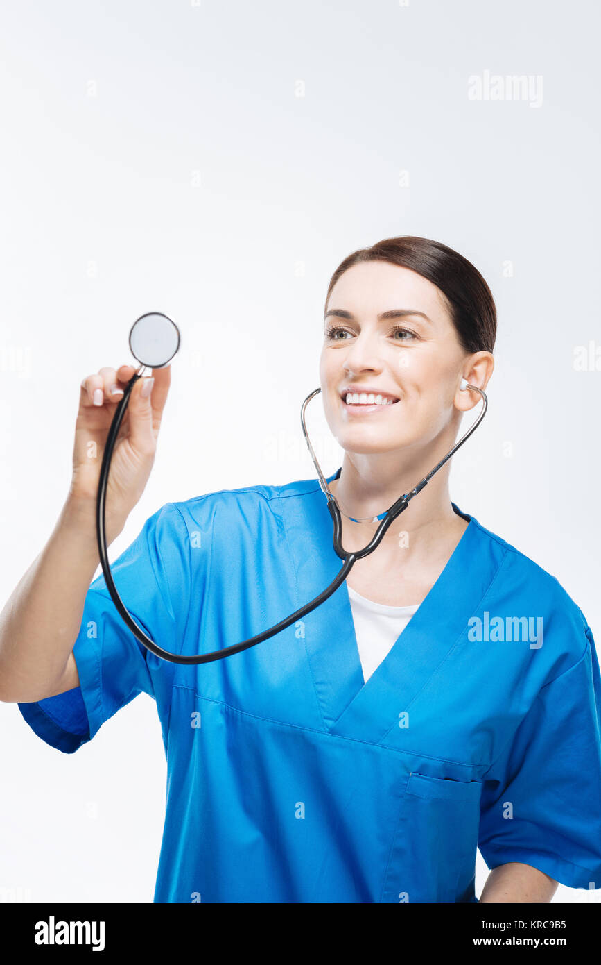 Inspired female doctor showing her skills Stock Photo - Alamy