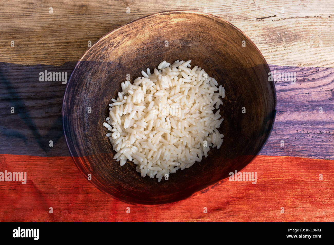 Poverty concept, bowl of rice with Russian flag Stock Photo - Alamy