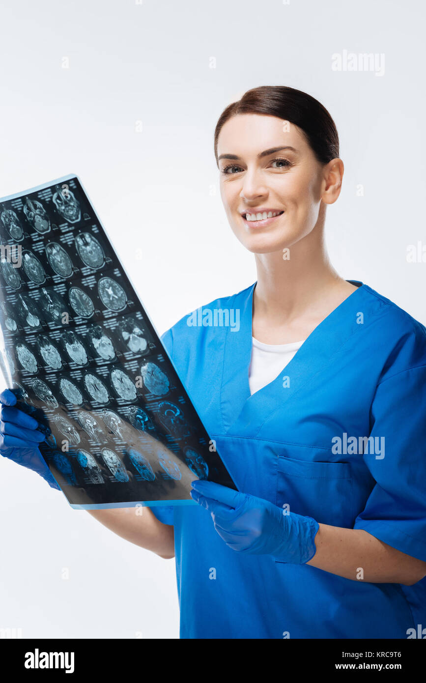Professional female doctor receiving scan Stock Photo - Alamy
