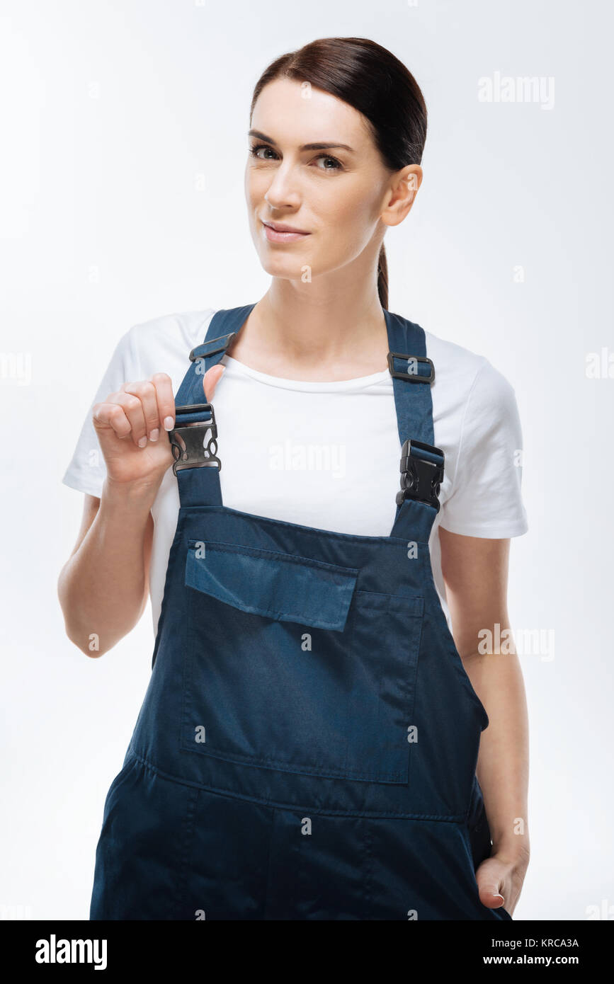 Young woman wearing coveralls hi-res stock photography and images - Alamy