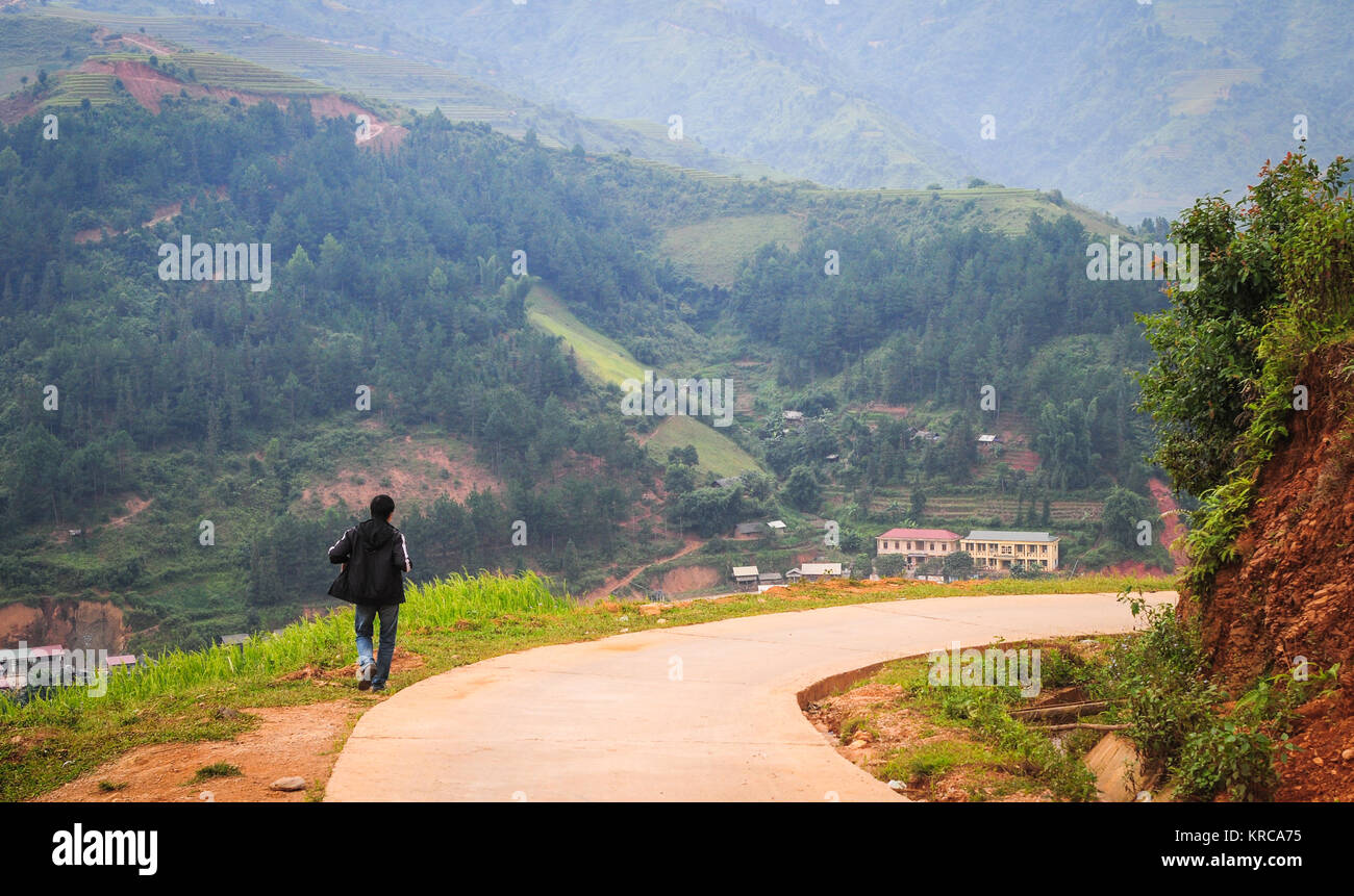 A man walking on rural road in Ha Giang Province, Vietnam Stock Photo ...