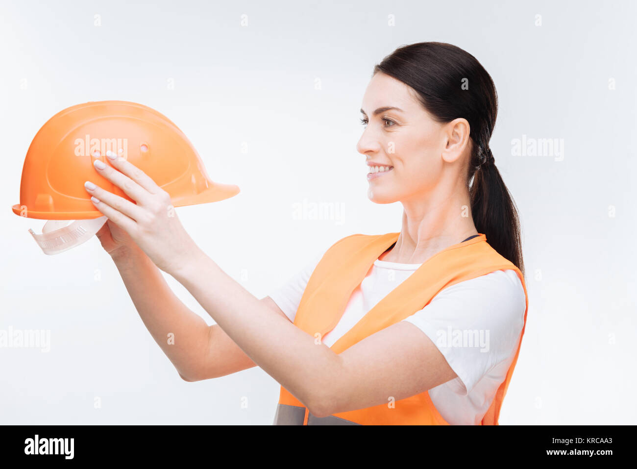 Young female worker demonstrating her readiness Stock Photo - Alamy