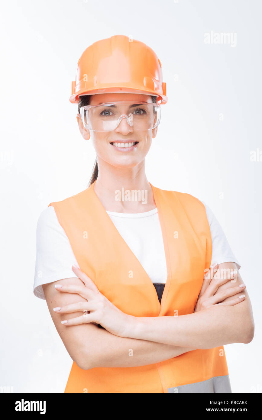 Optimistic female worker checking work Stock Photo - Alamy