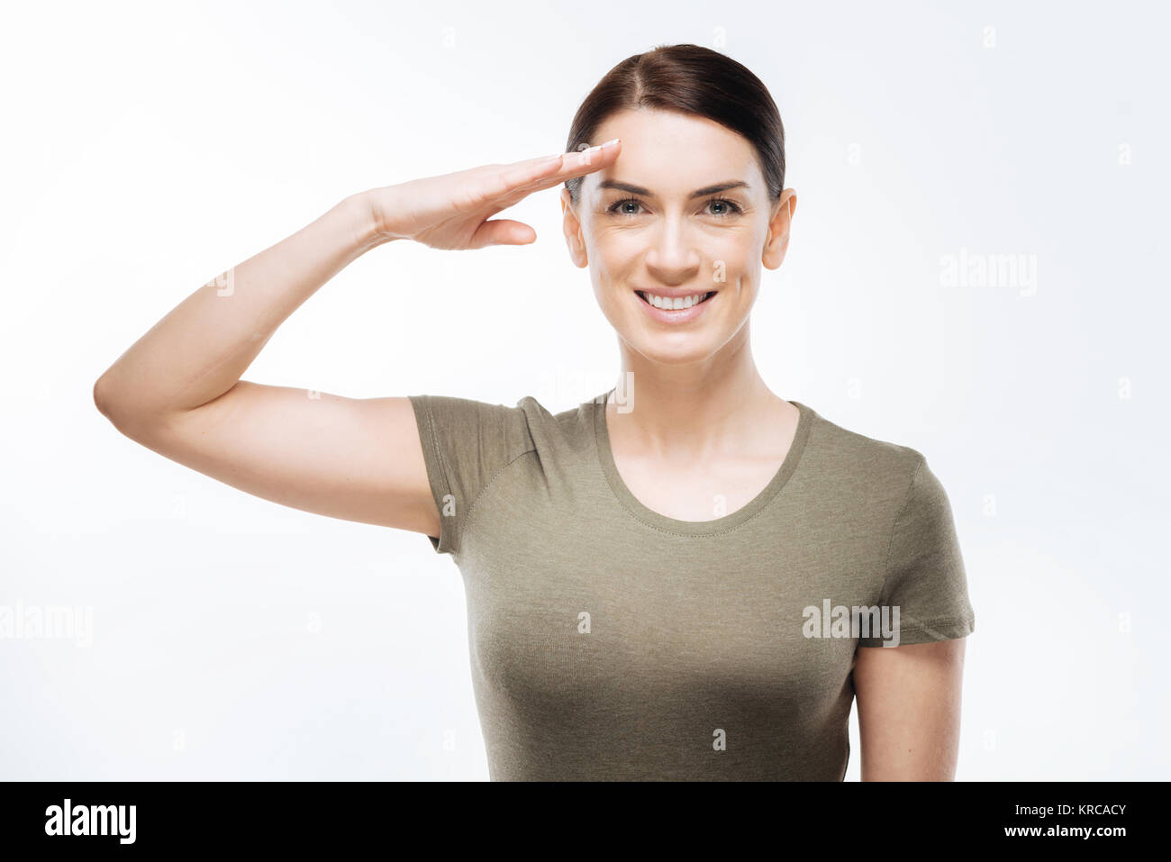Joyful female soldier saluting the commander Stock Photo - Alamy
