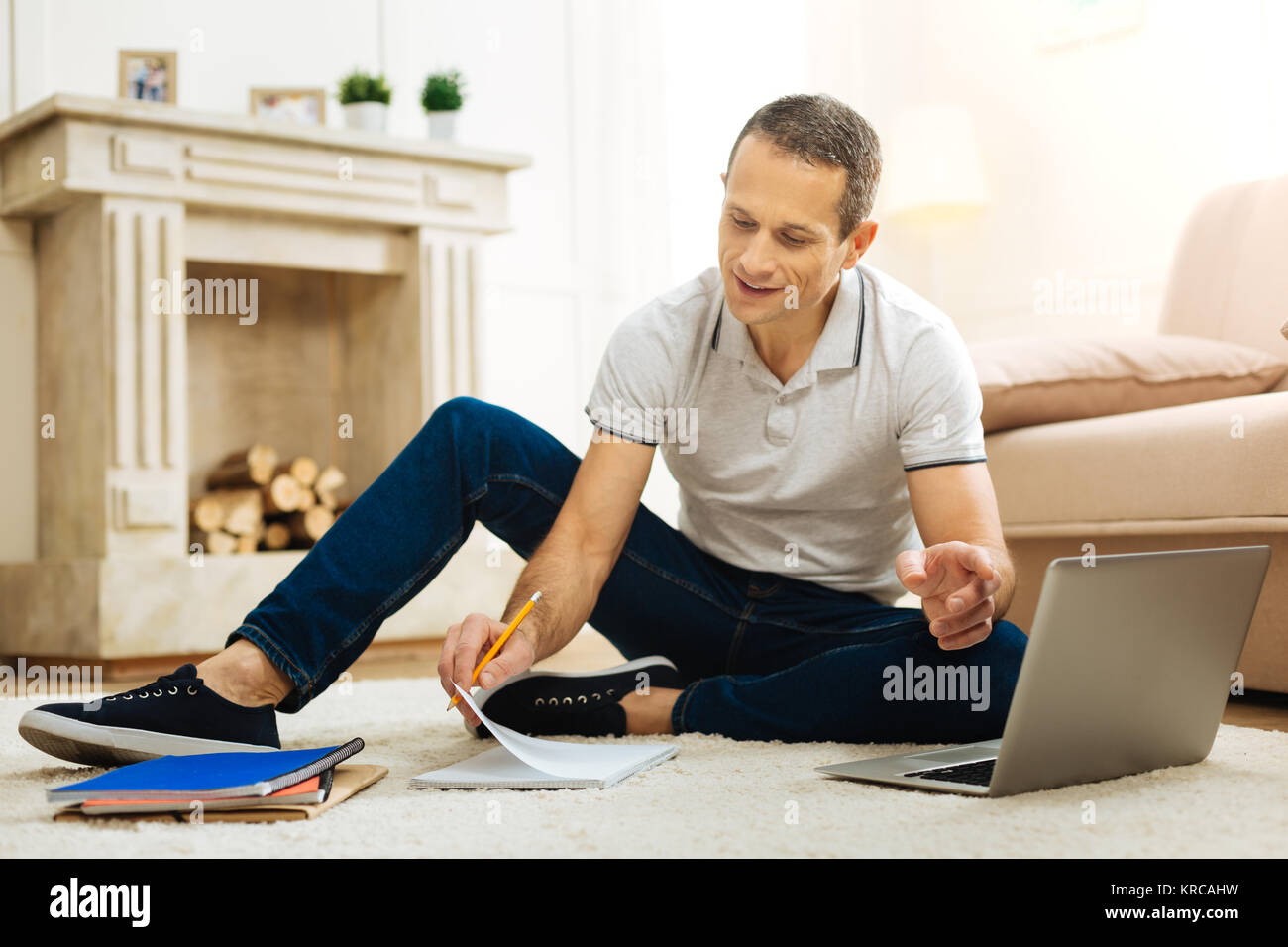 Smart handsome man feeling glad while working at home Stock Photo - Alamy