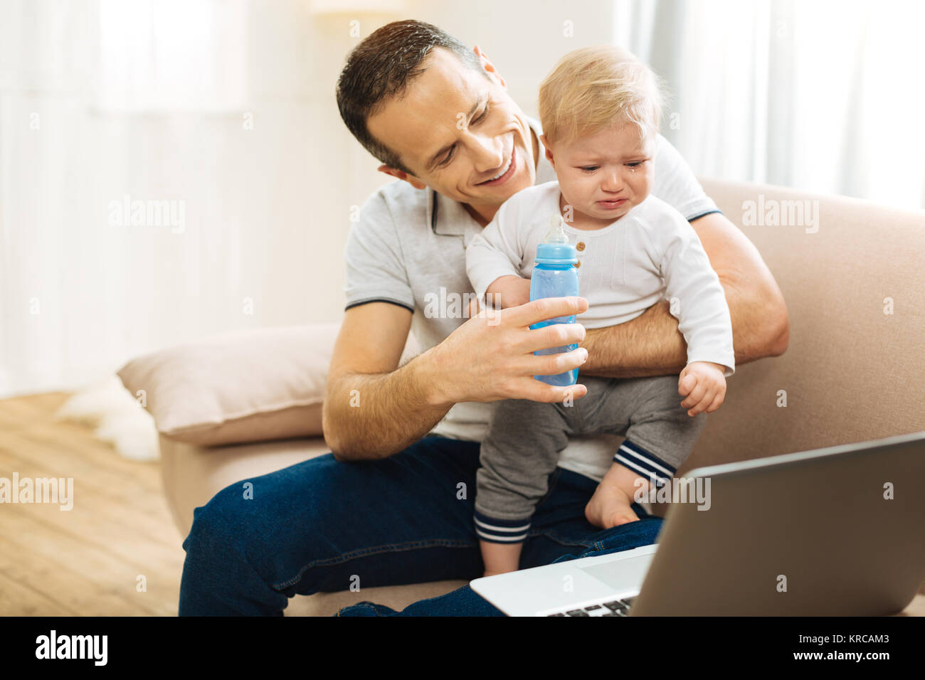 Father comforting crying child hi-res stock photography and images - Alamy