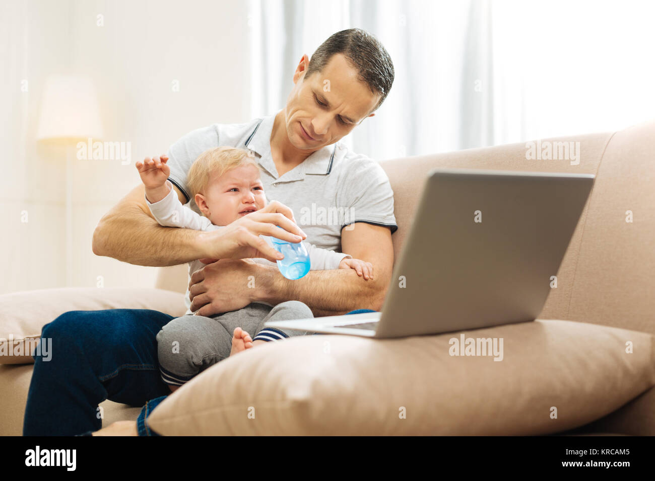 Father comforting crying child hi-res stock photography and images - Alamy