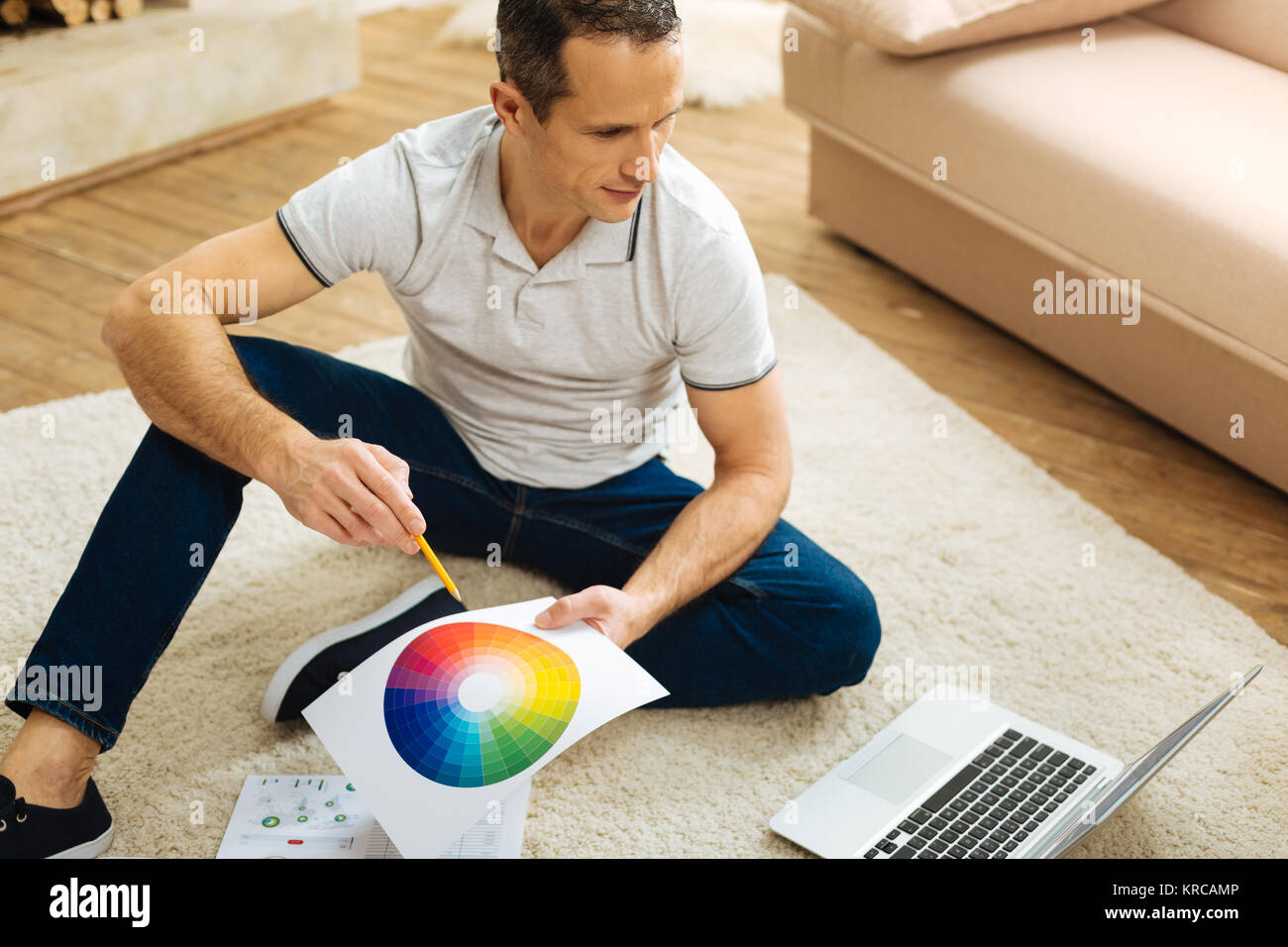 Creative clever designer working at home and feeling glad Stock Photo ...