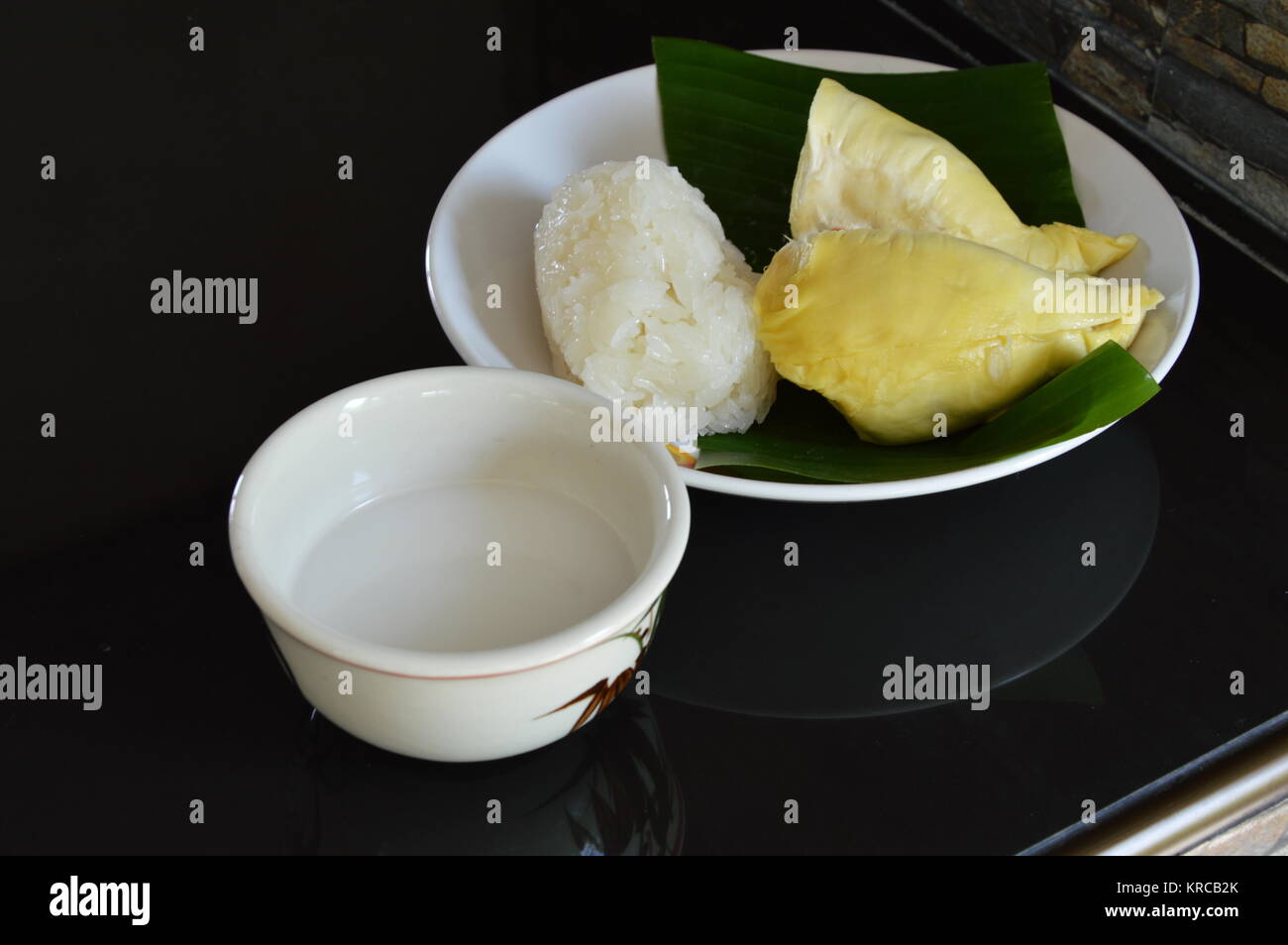 durian and sticky rice dressing with coconut milk Stock Photo - Alamy