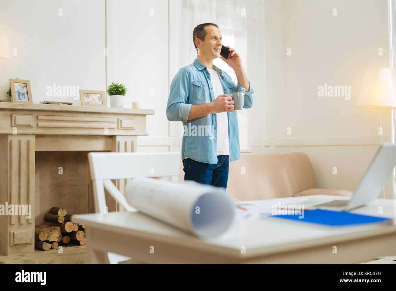 Helpful engineer explaining helping his colleague when talking on the ...