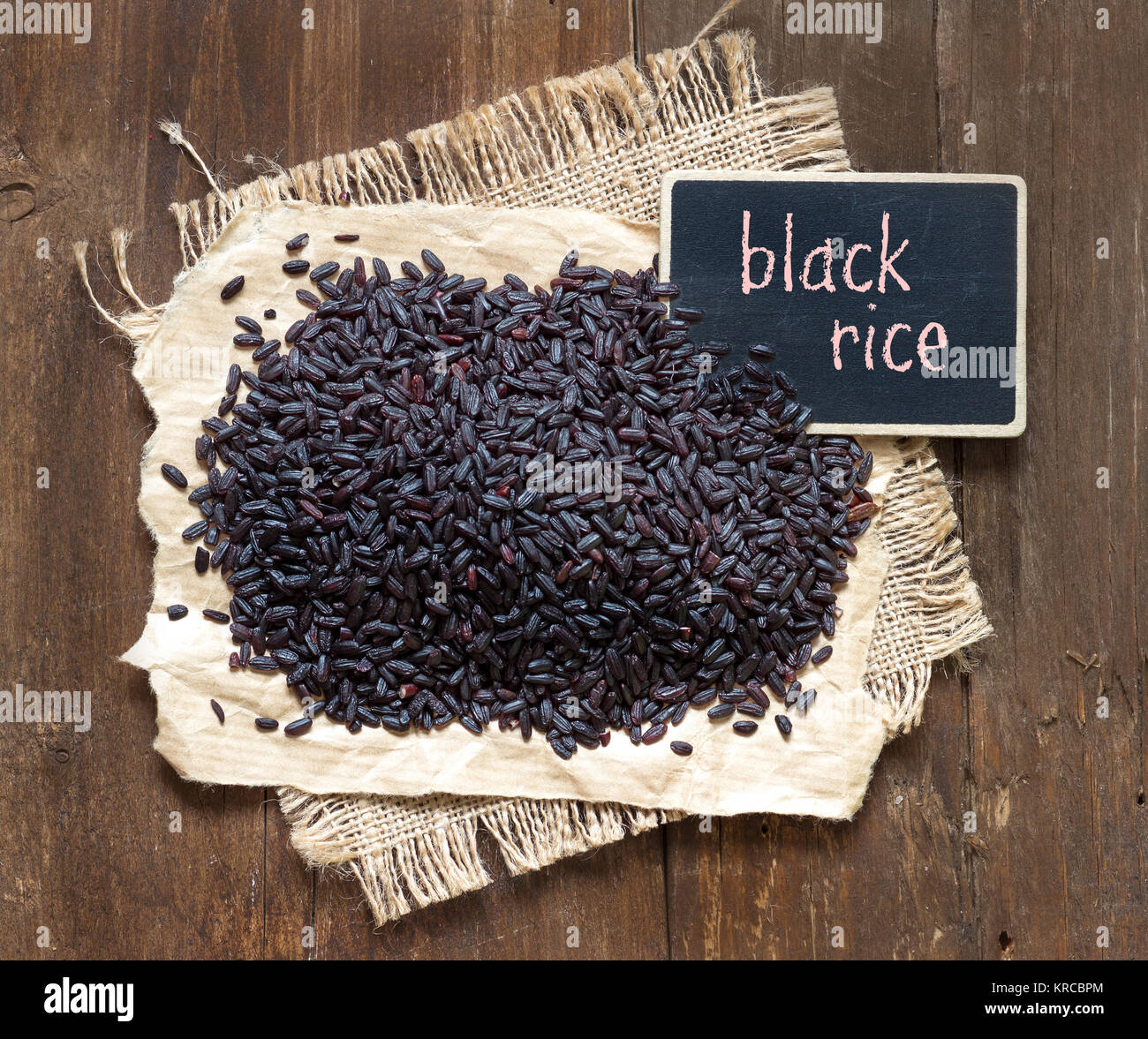 Black rice with small chalkboard Stock Photo - Alamy