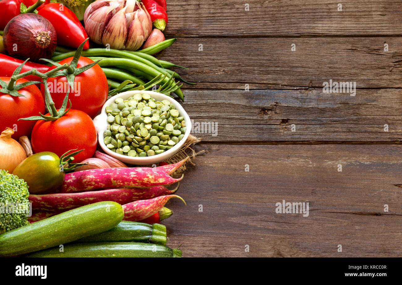 Raw Organic green peas and vegetables Stock Photo - Alamy