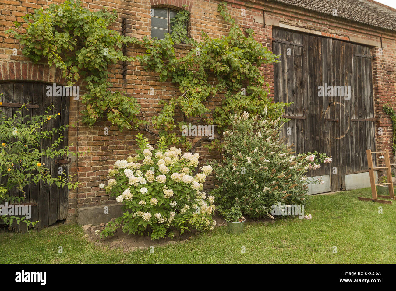 landscaped brick facade of a barn wall Stock Photo - Alamy