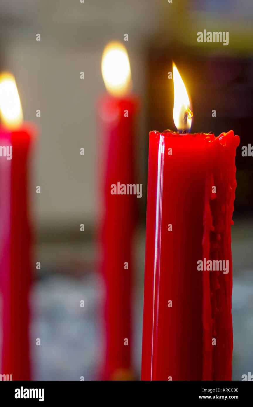 Many long burning candles hi-res stock photography and images - Alamy