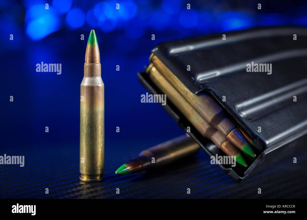 Cartridges and a magazine for an AR-15 with a blue background Stock ...