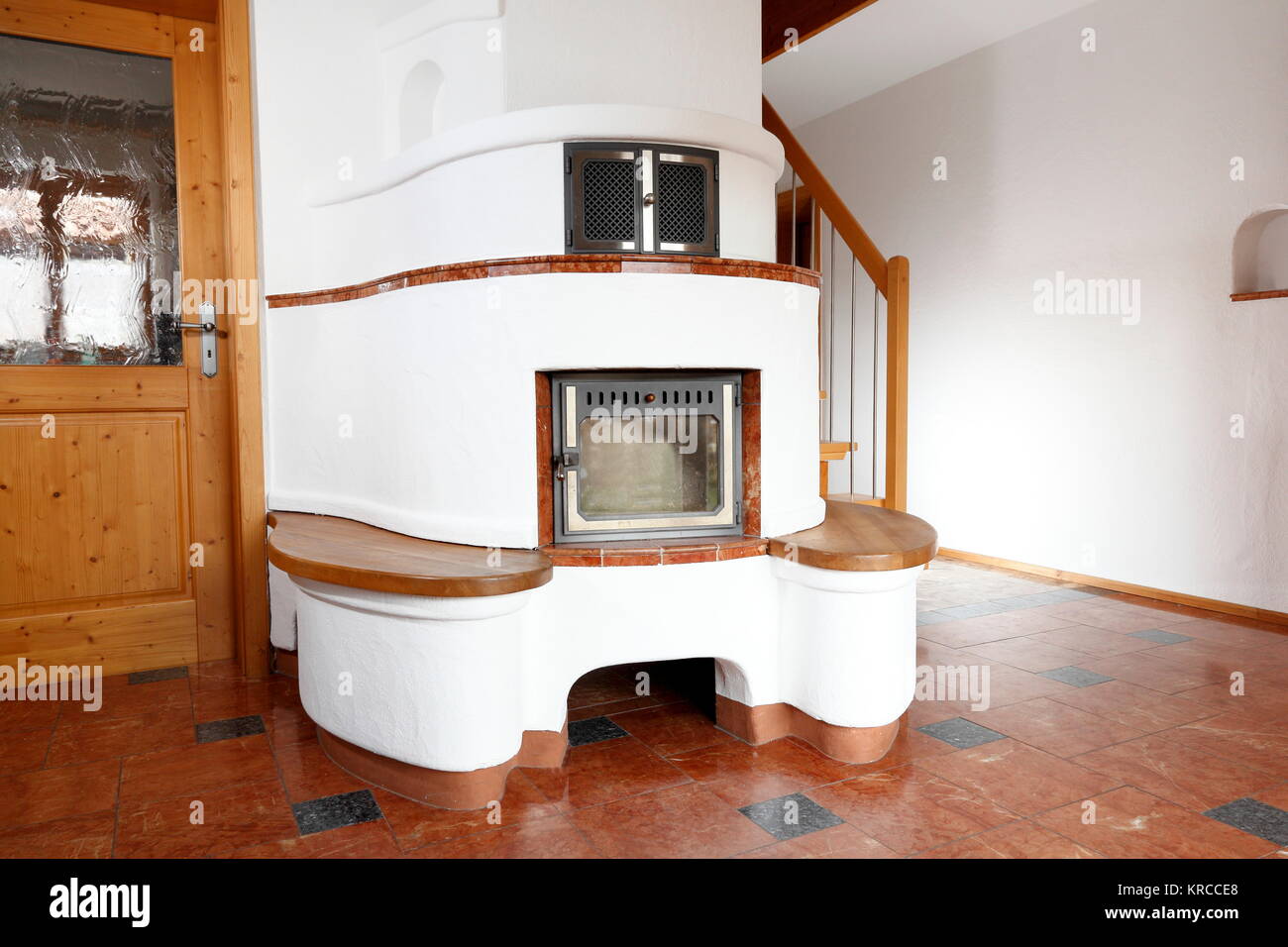 round wood stove in the room Stock Photo - Alamy