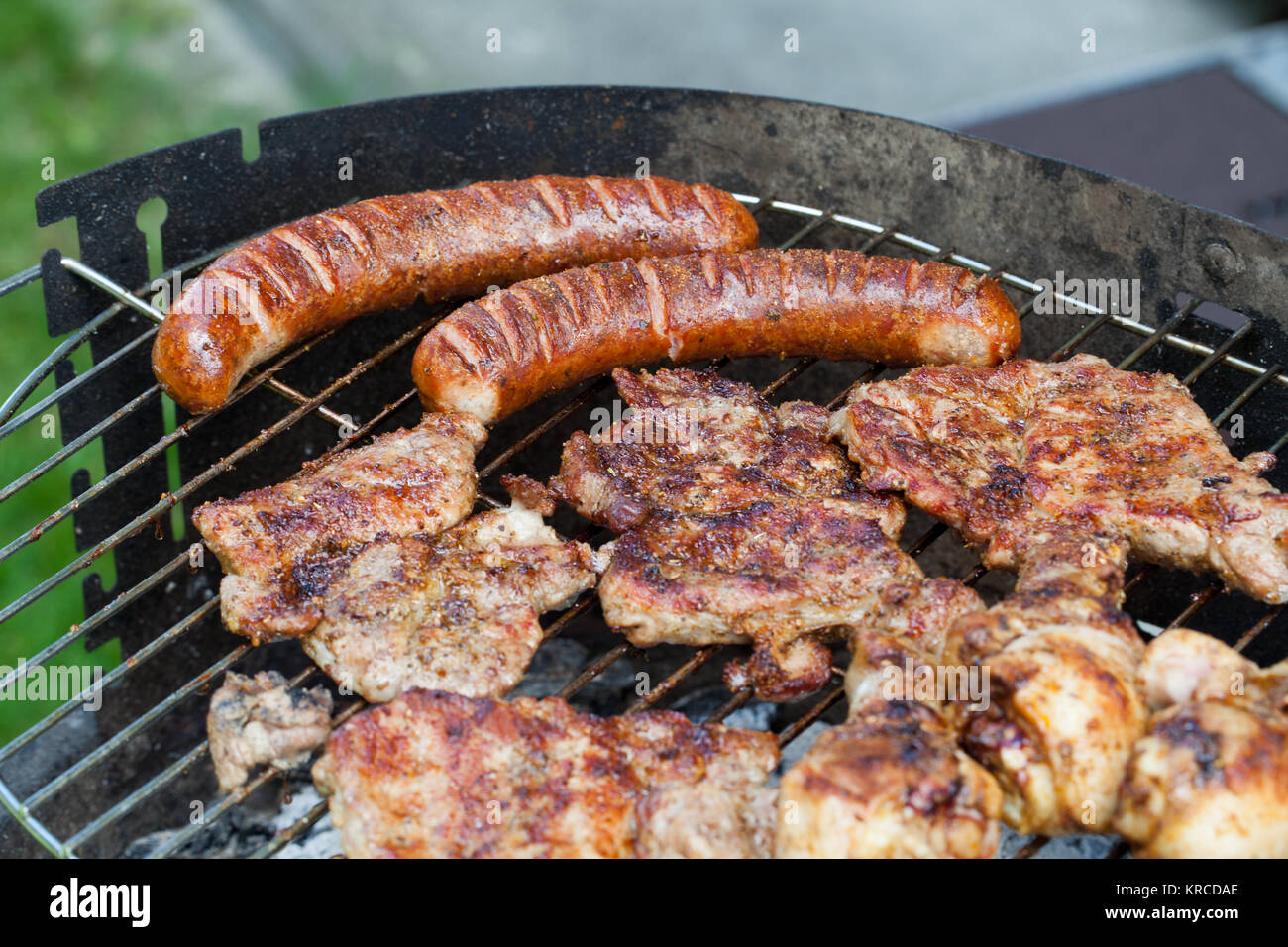 barbecue with delicious grilled meat on grill Stock Photo - Alamy